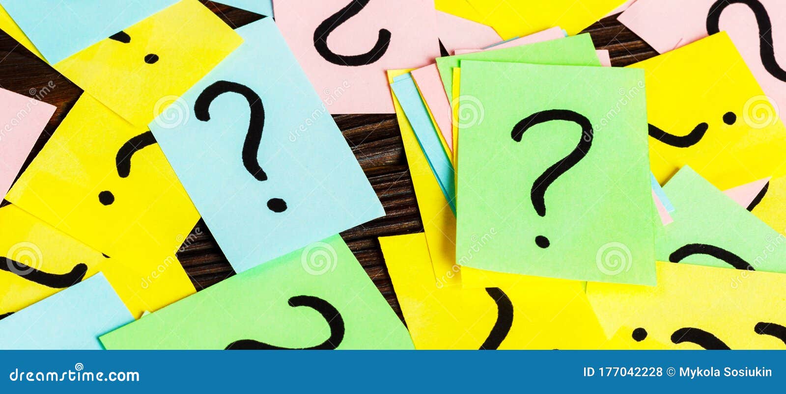 Pile of Colorful Paper Notes with Question Marks on Wooden Background ...