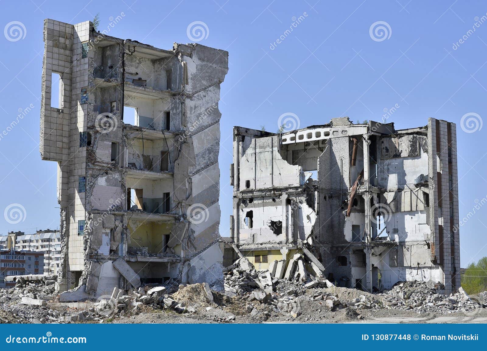 A Pile of Concrete Debris on the Background of a Large Destroyed ...