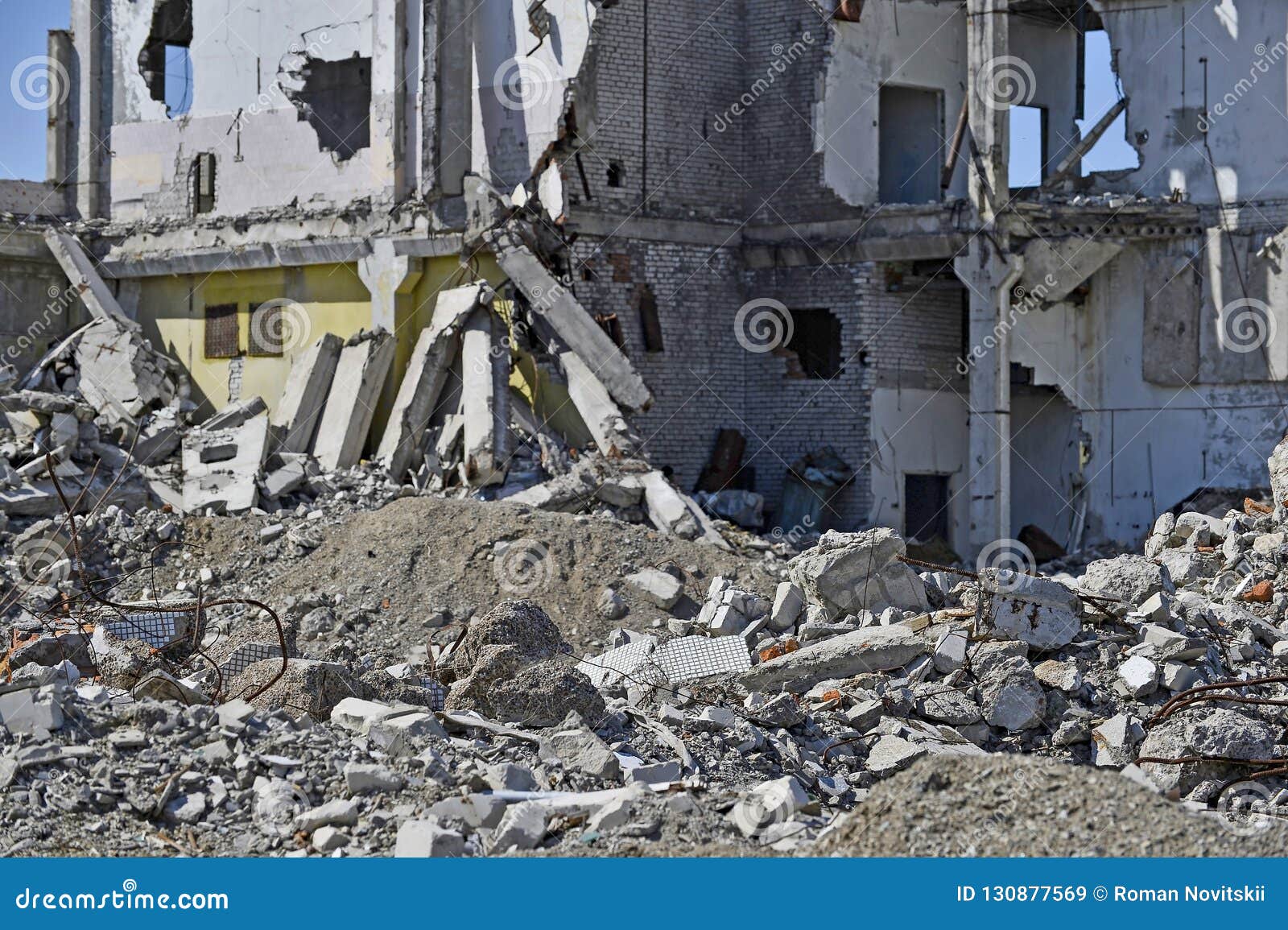 A Pile Of Concrete Debris On The Background Of A Large Destroyed ...