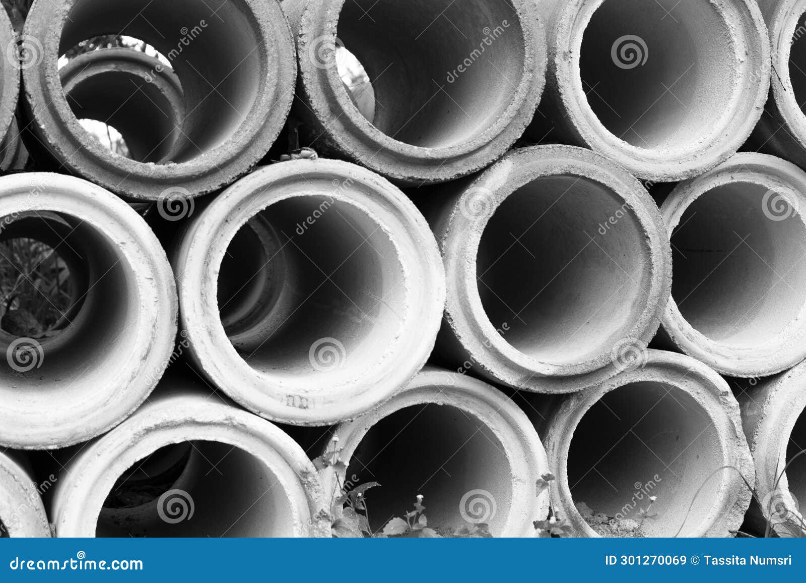 Pile of Concrete Sewer Pipes on Concrete Plant Grounds Stock Image ...