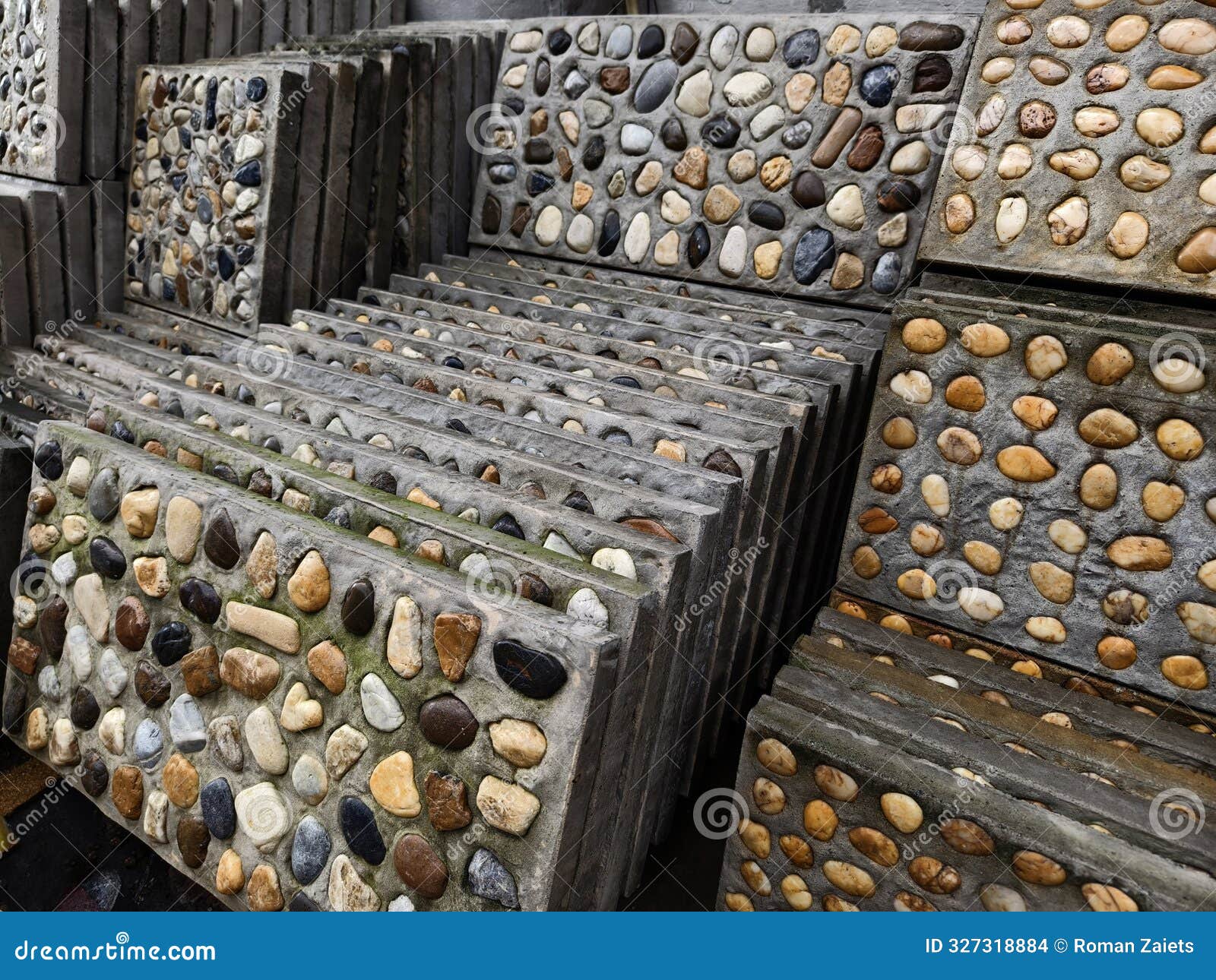 A Pile of Concrete Tiles Filled with Rocks on Top Stock Photo - Image ...