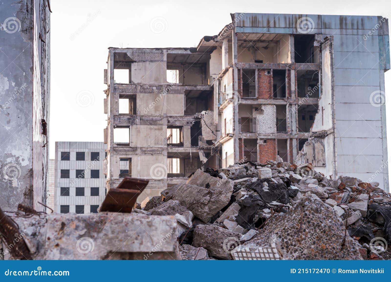 A Pile of Construction Debris Lies Against the Background of a Large ...