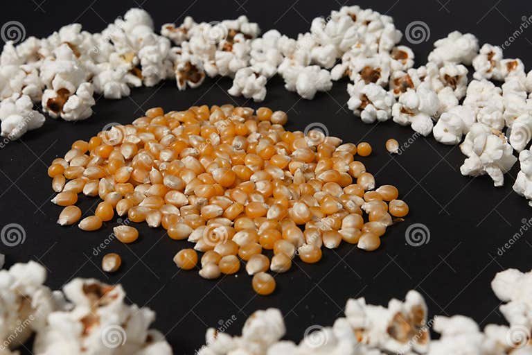 A Pile of Corn Kernels in the Middle of a Ready-made Popcorn Circle. Stock Image - Image of ...