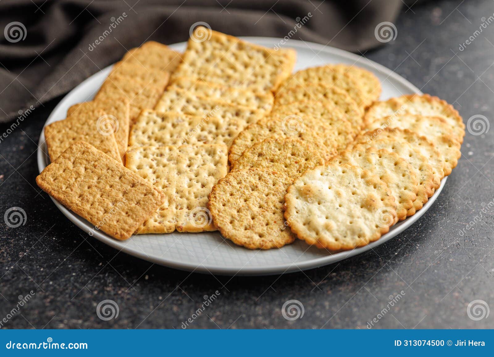 Pile of Crackers on Plate on Kitchen Counter Stock Photo - Image of ...