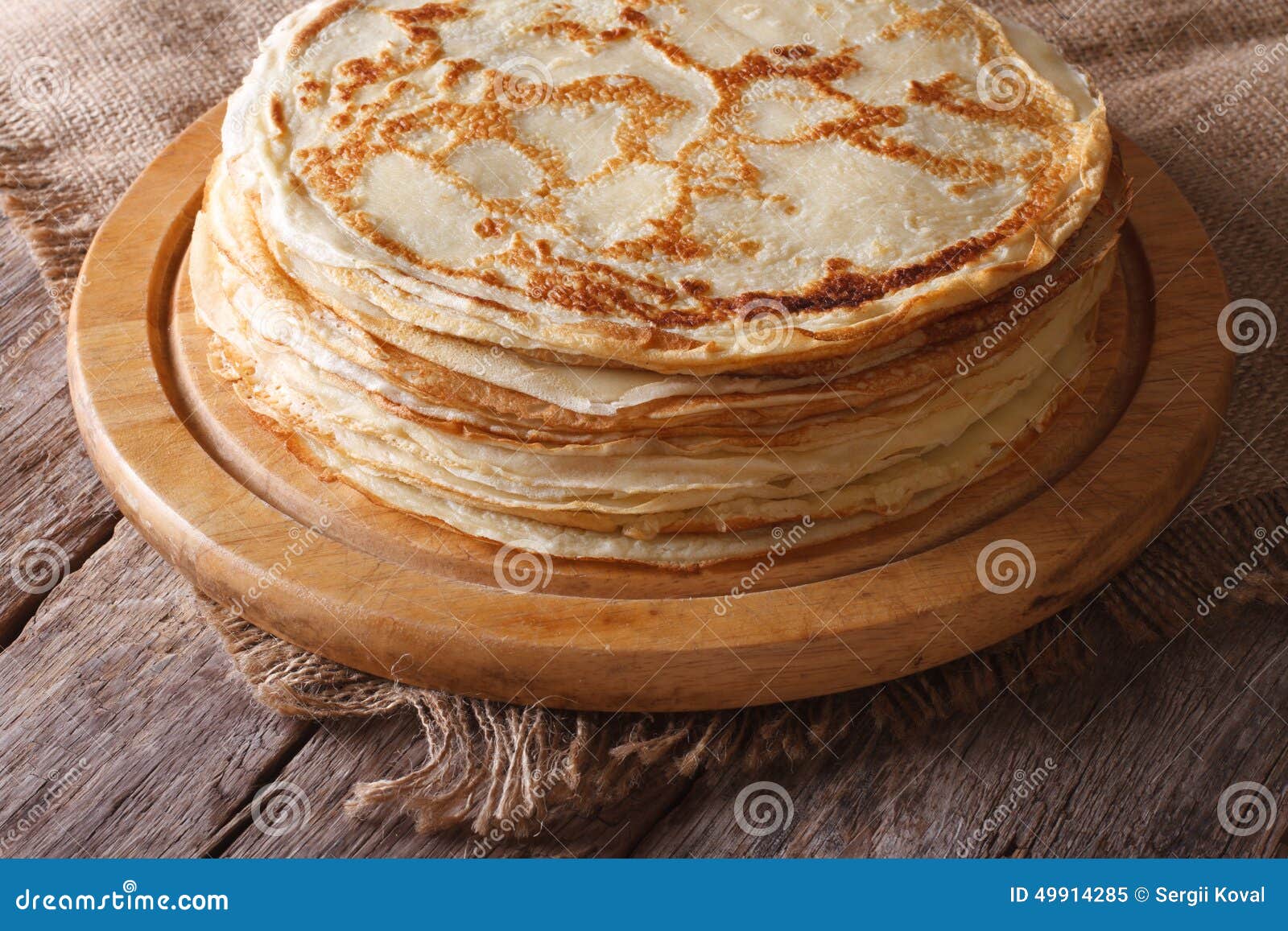Pile of Crepes on a Kitchen Board on the Table. Horizontal Stock Image ...