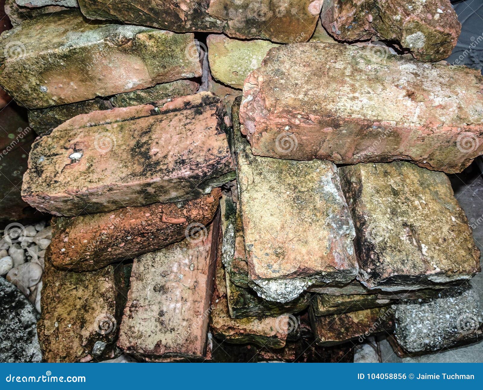 Pile of crumbling bricks stock photo. Image of heap - 104058856