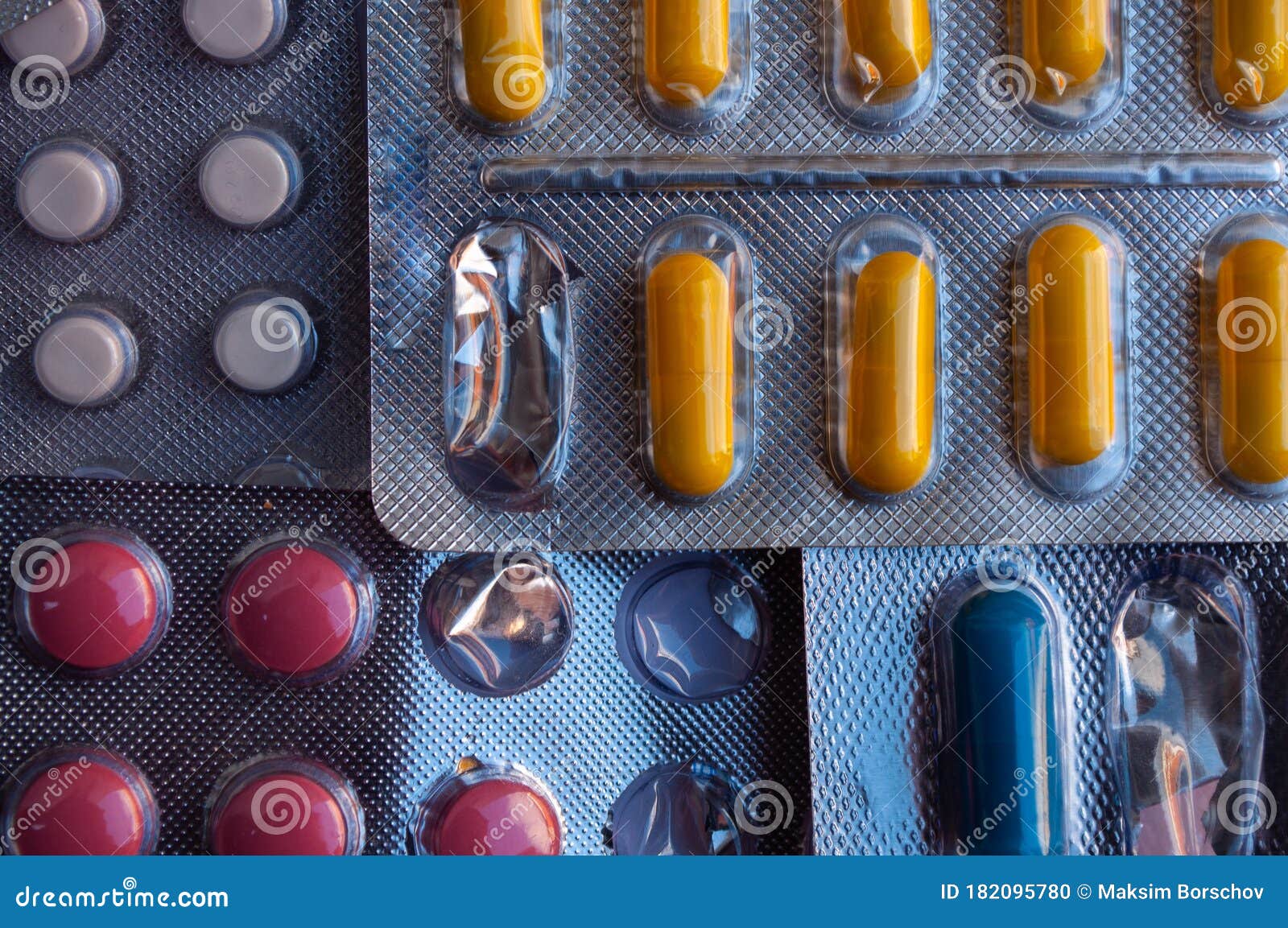 Pile of Different Colored Tablets in a Half Open Blister Pack ...