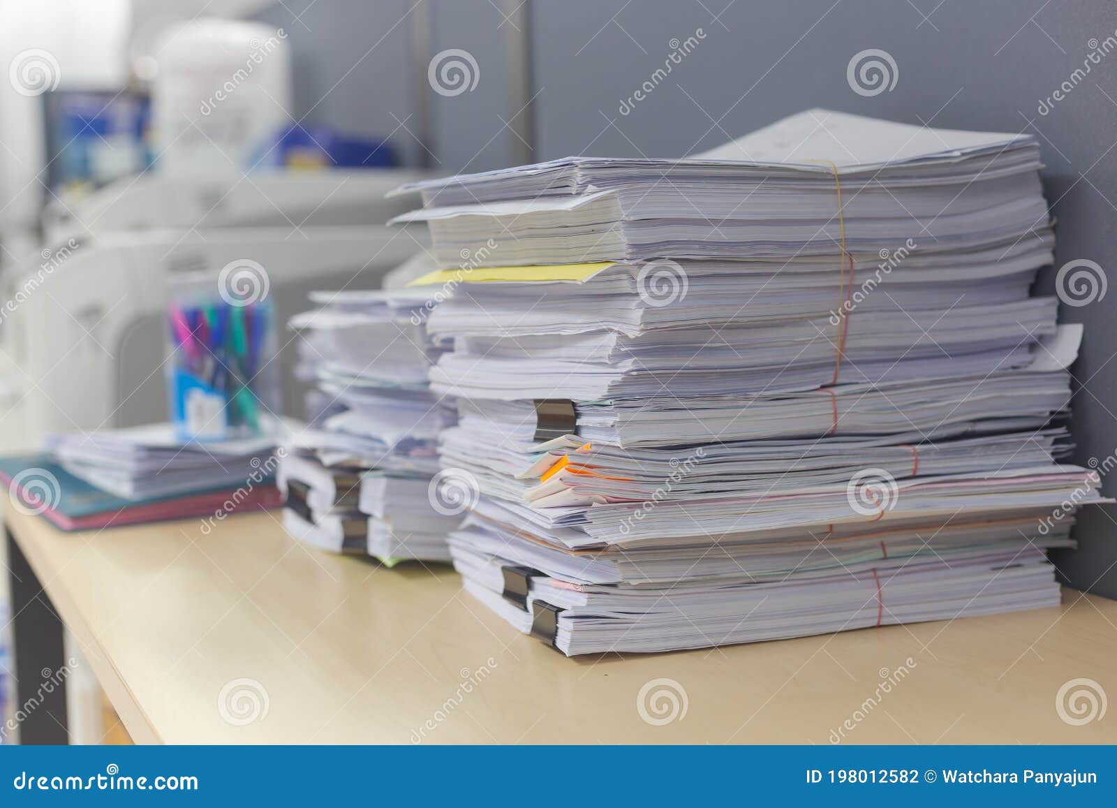 Pile of Documents on Desk Stack Up High Waiting To Be Managed Stock ...