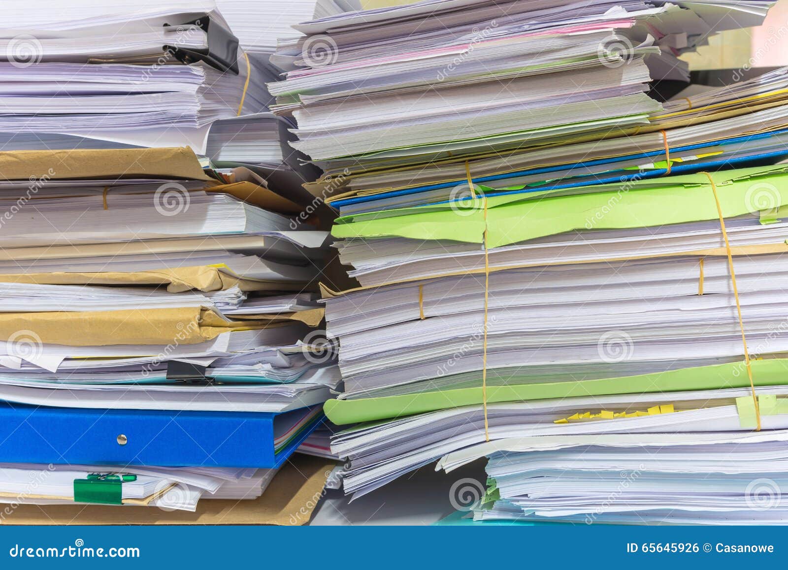 Pile of Documents on Desk Stack Up High Waiting To Be Managed Stock ...