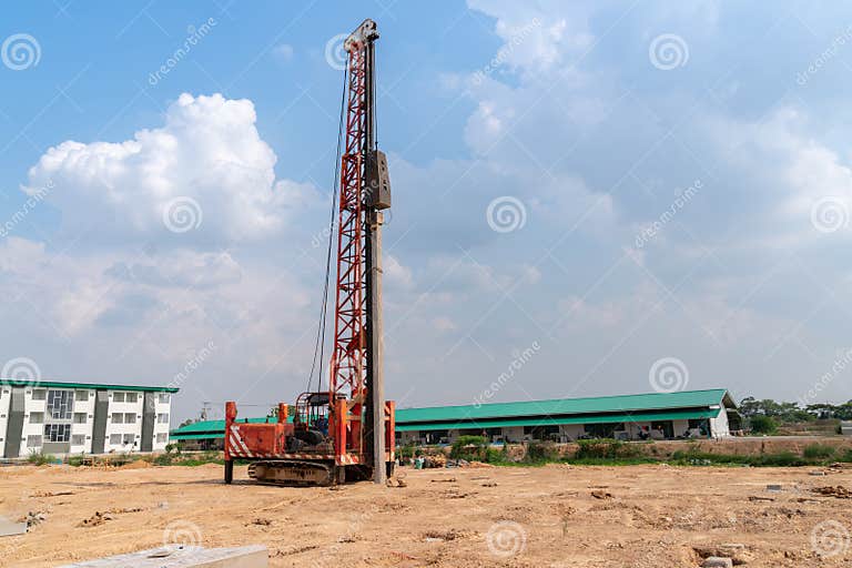 A Pile Driver is Driving Piles into the Ground Stock Photo - Image of ...