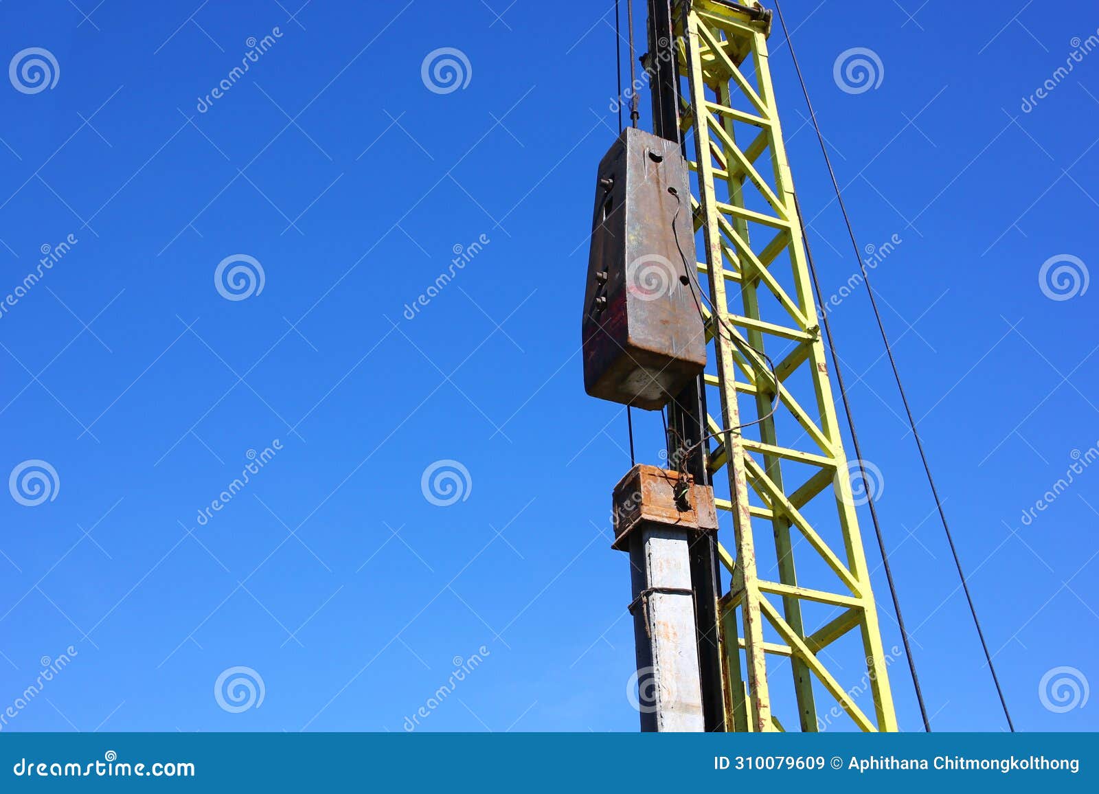Pile Driving Crane Working in Construction Site Against Blue Sky Stock ...