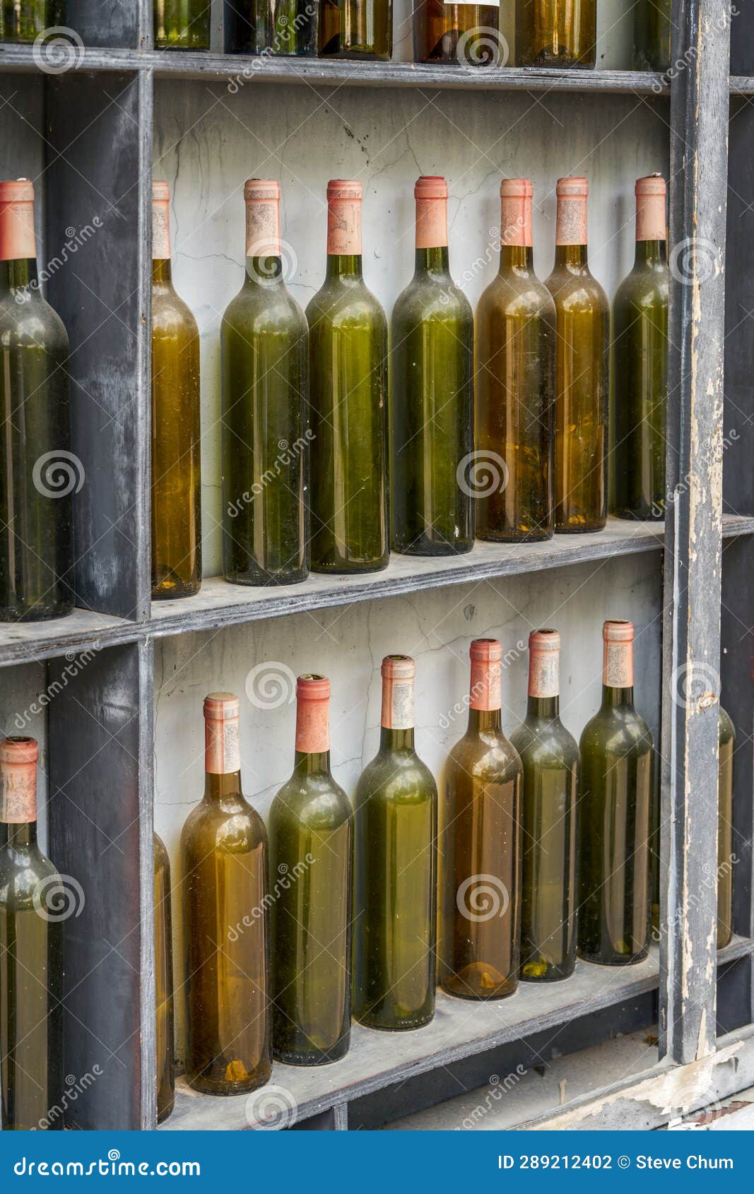 Pile of Empty Red Wine Bottles on Display Window Outdoors Stock Photo ...