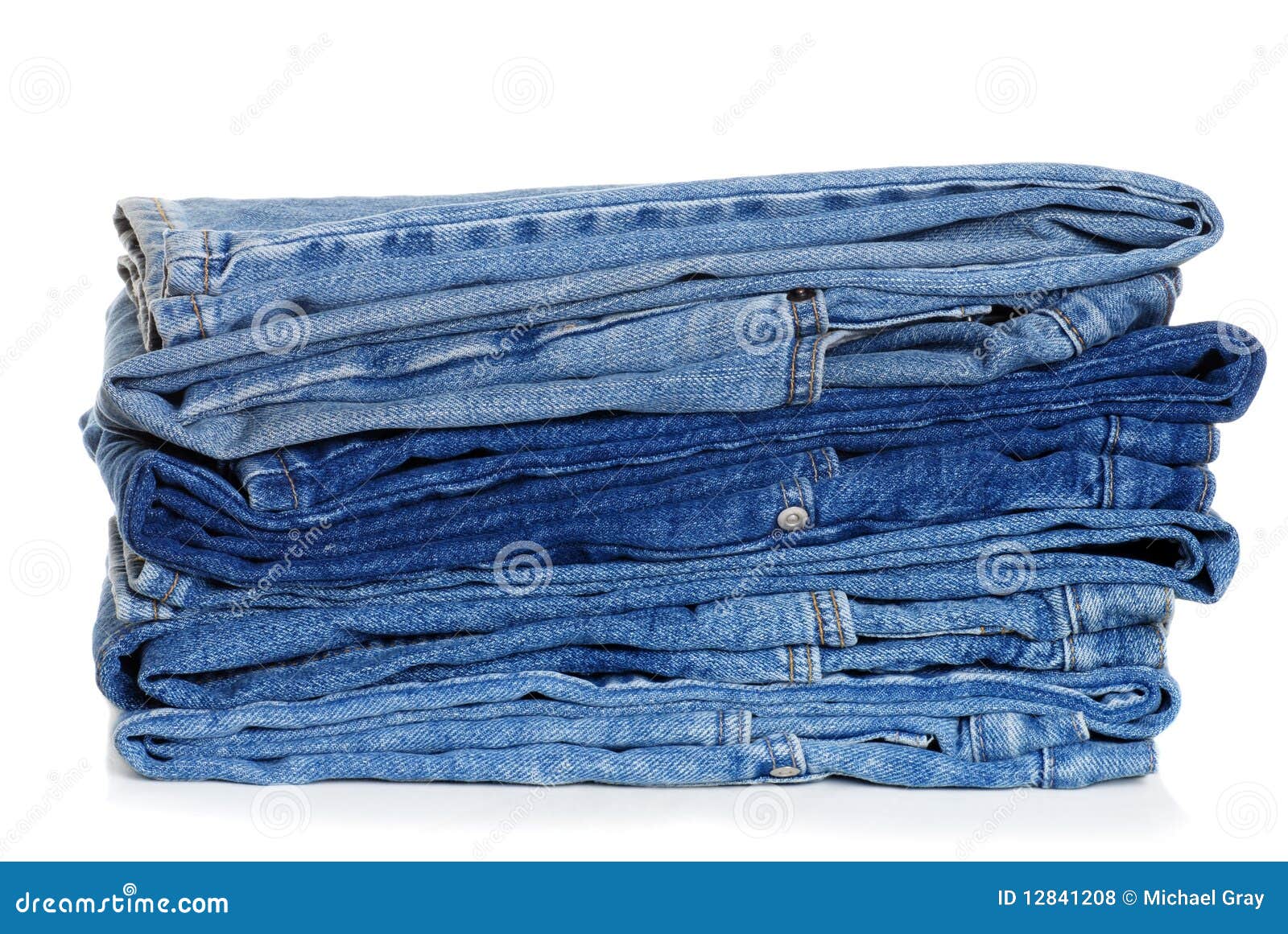 Pile of Folded Blue Jeans stock photo. Image of stack - 12841208