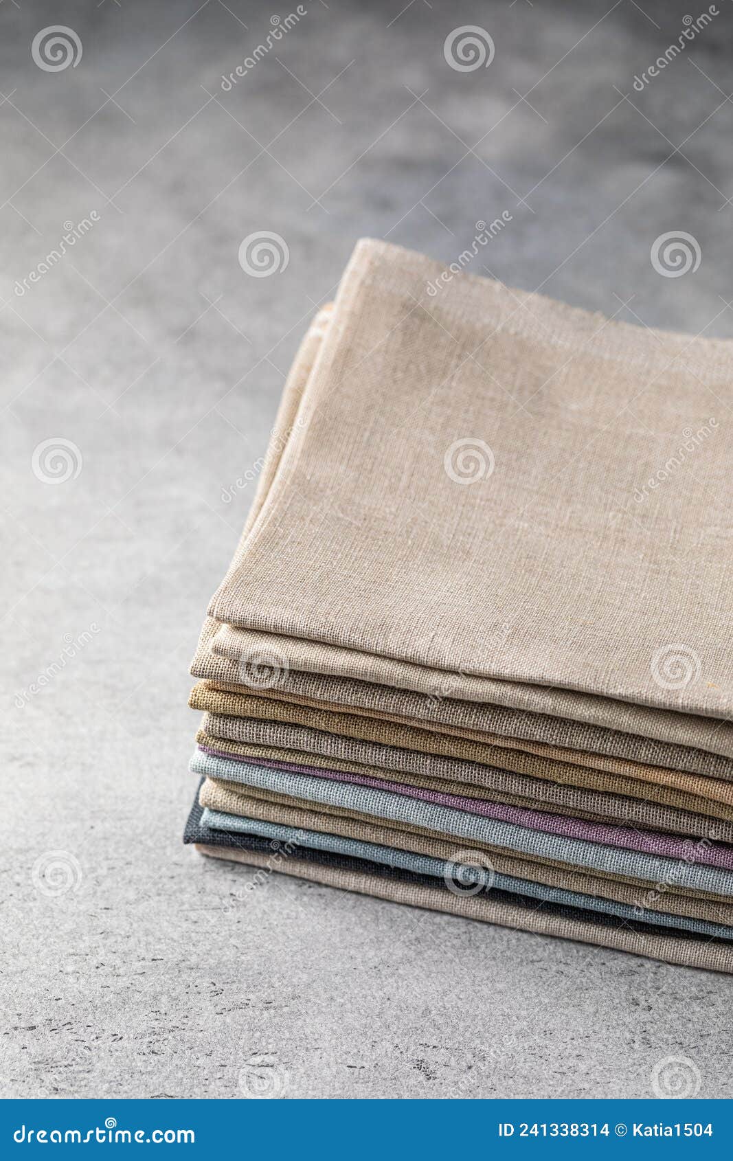 A Pile of Four Folded Dull-colored Natural Linen Fabric Stock Photo ...