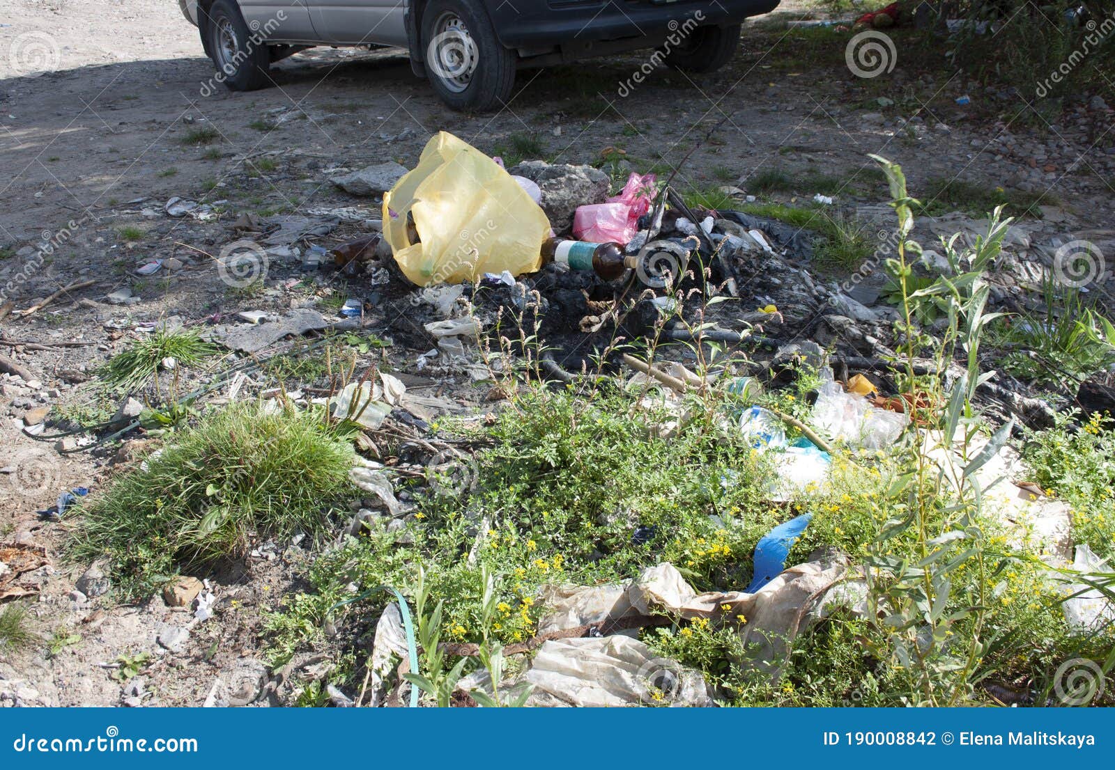 A Pile of Garbage in a Picnic Clearing Next To a Machine Stock Photo ...