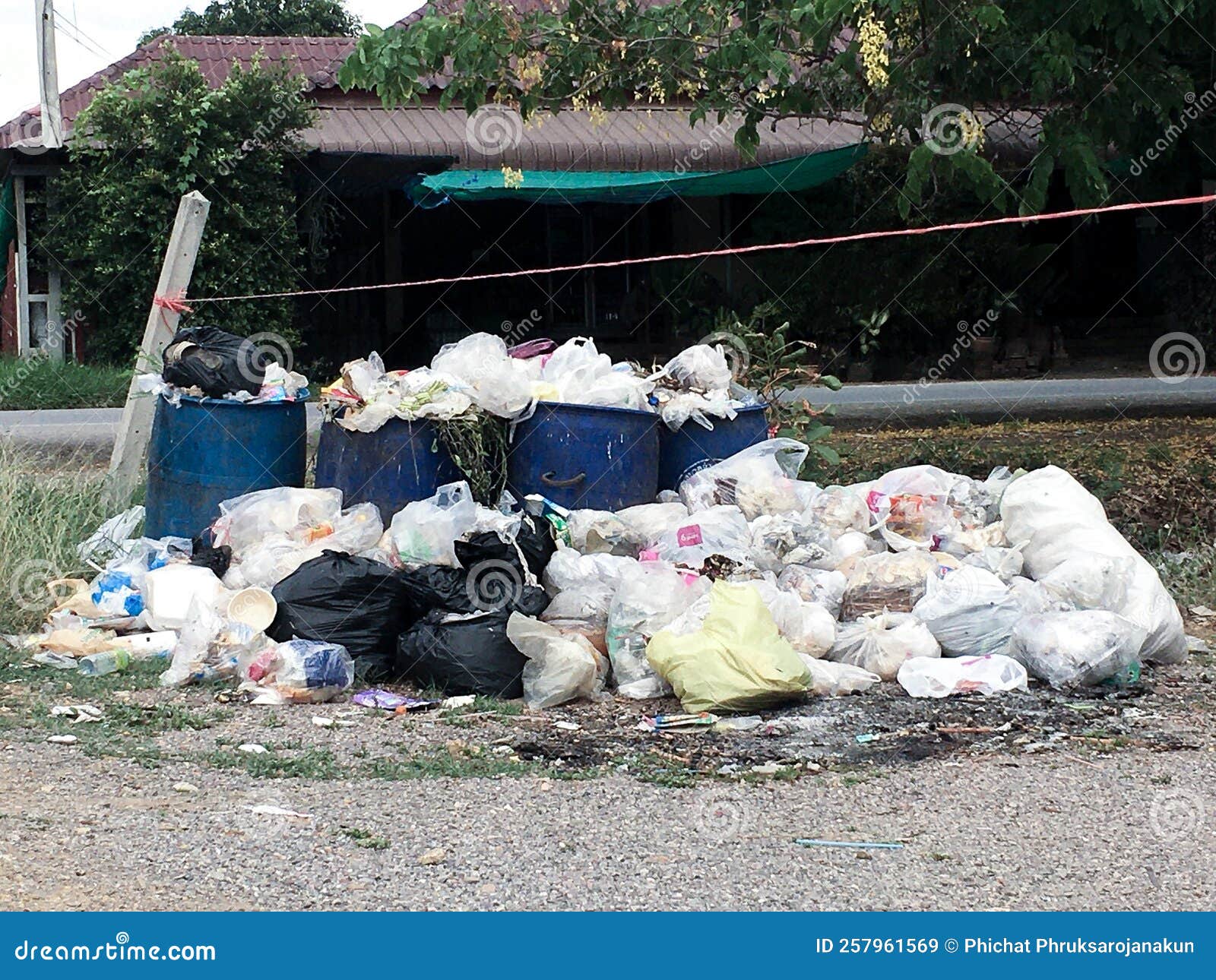 Pile Group of the Garbage Bag on the Ground and Trash Drum beside the ...