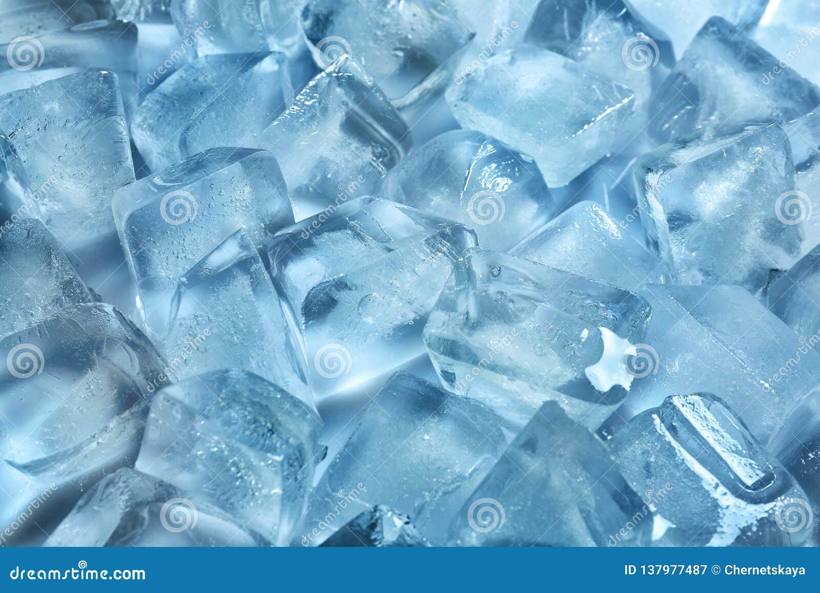 Pile of ice cubes on color stock image. Image of freezer - 137977487