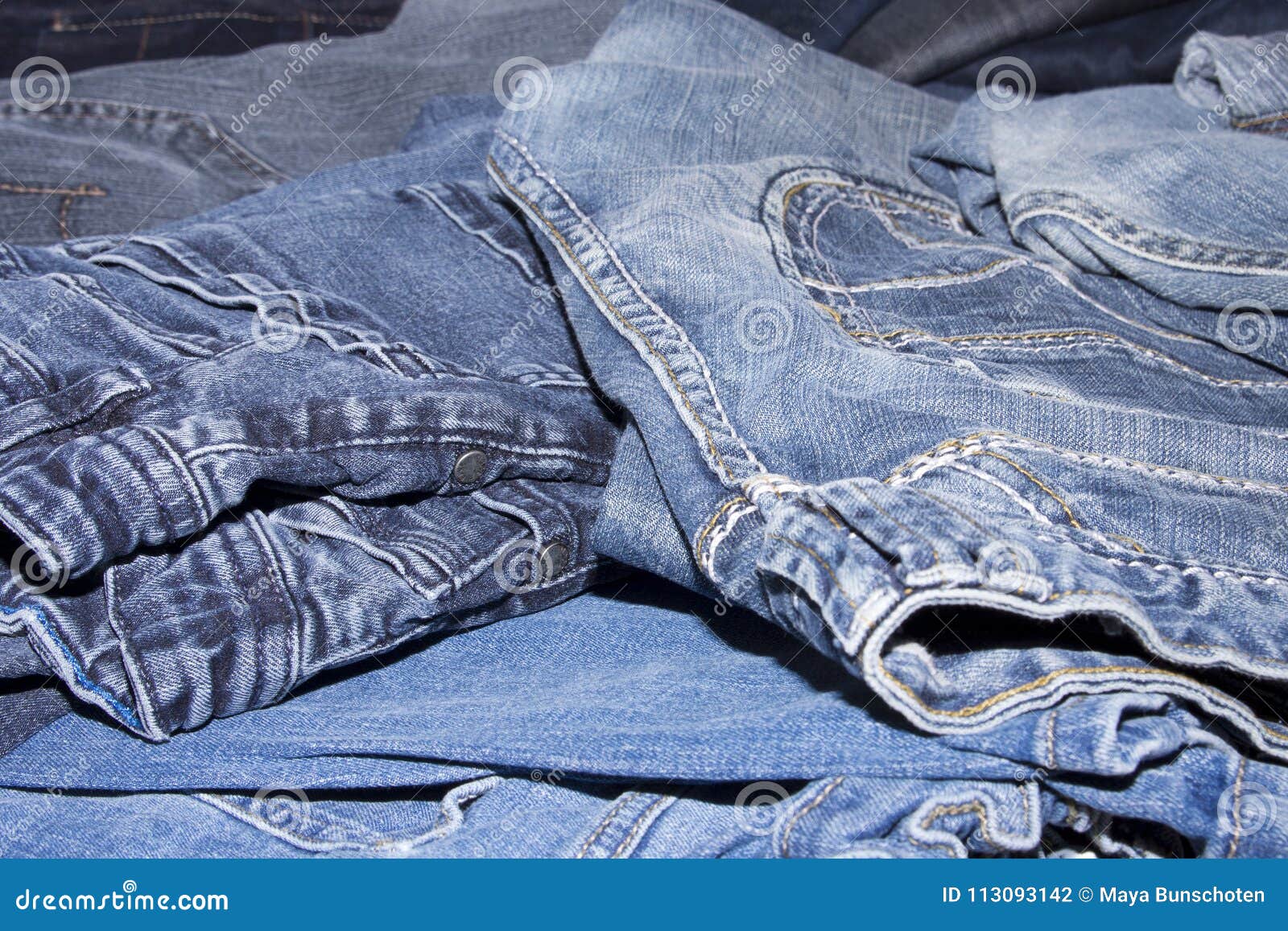 Pile of jeans stock photo. Image of pile, clothes, garment - 113093142