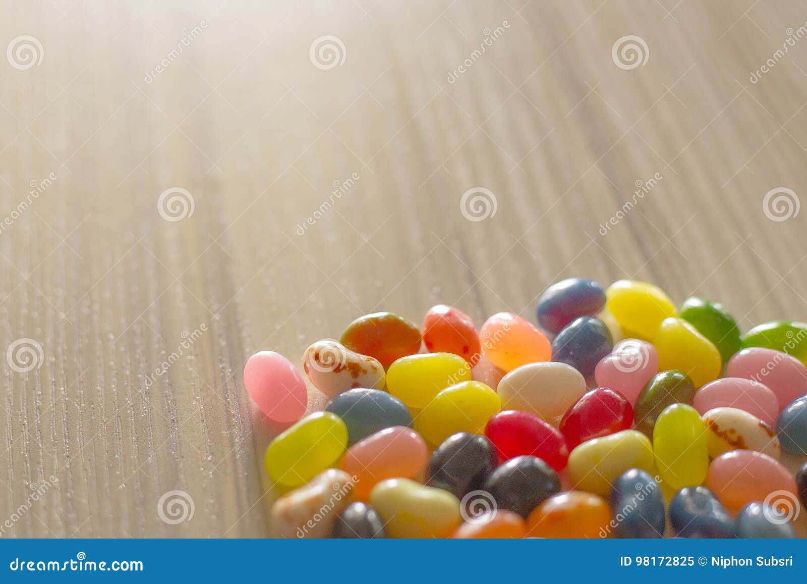 Pile of Jelly Beans Multi Color on Wood Table Stock Image - Image of ...