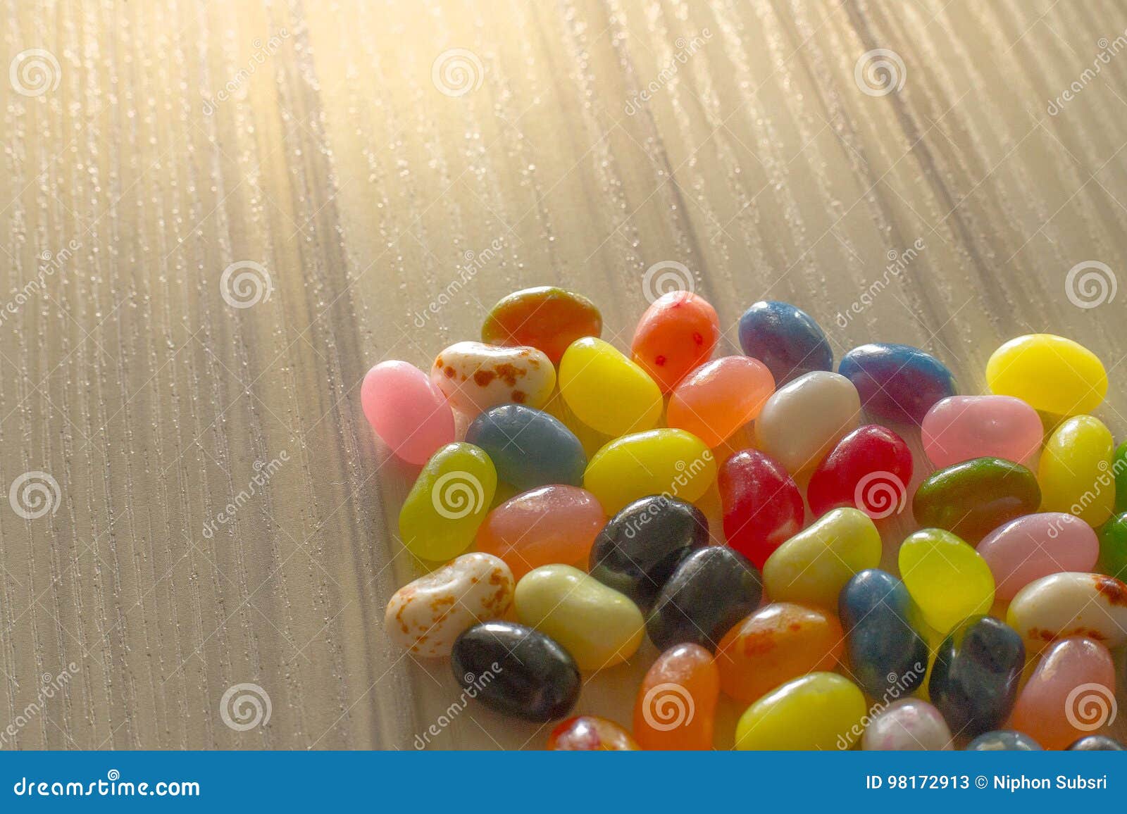 Pile of Jelly Beans Multi Color on Wood Table Stock Image - Image of ...