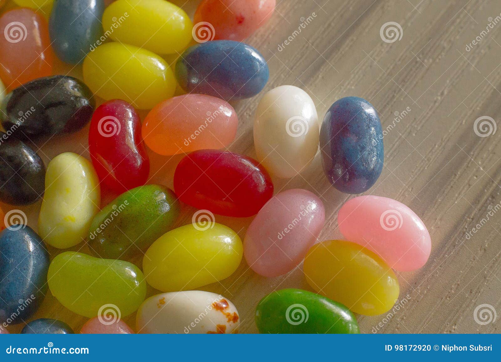 Pile of Jelly Beans Multi Color on Wood Table Stock Photo - Image of ...