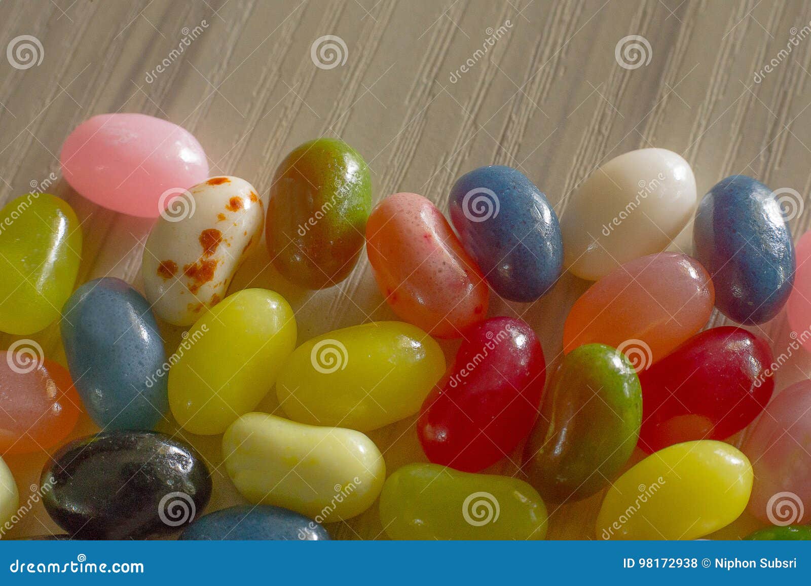 Pile of Jelly Beans Multi Color on Wood Table Stock Photo - Image of ...