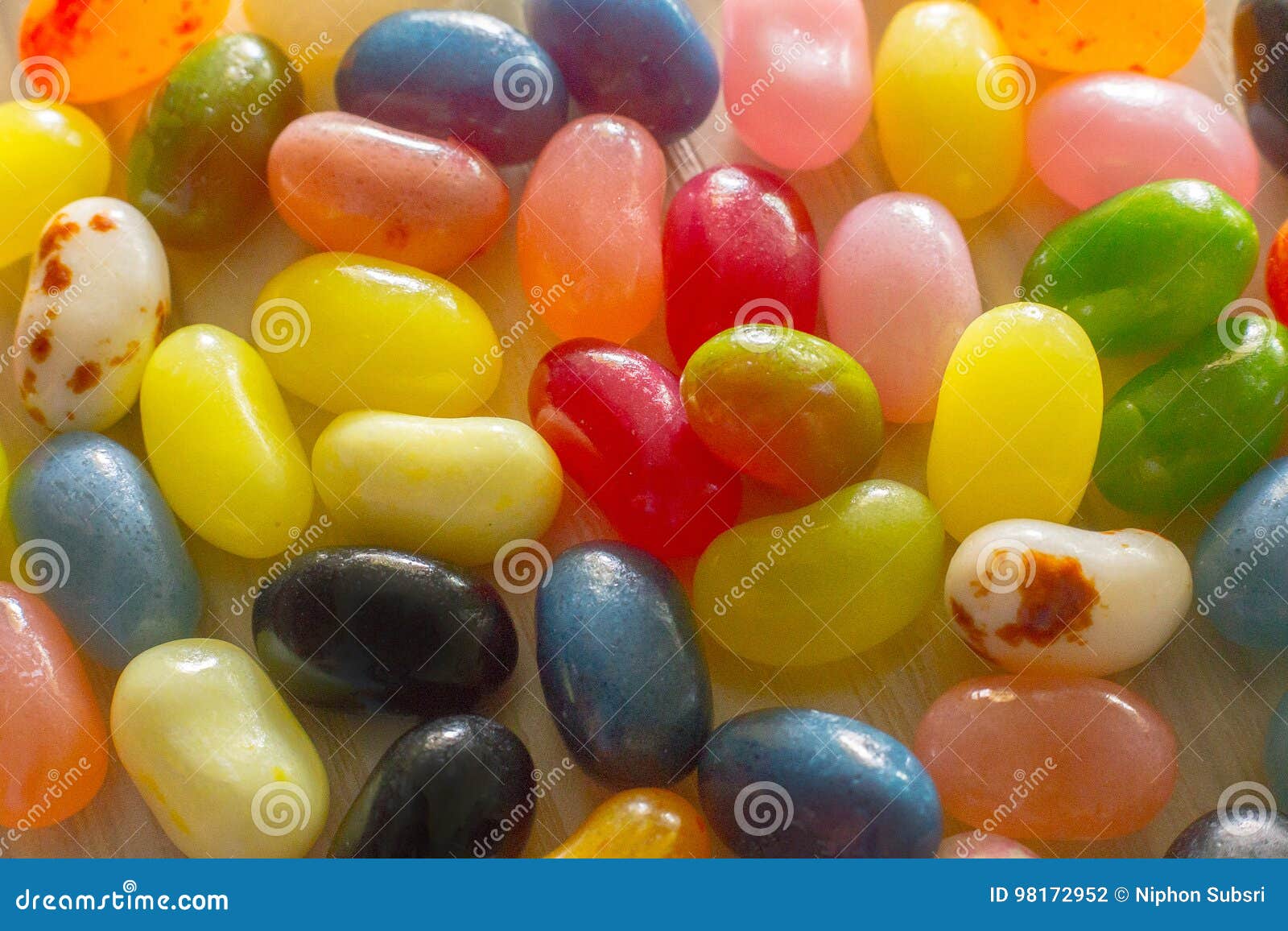 Pile of Jelly Beans Multi Color on Wood Table Stock Photo - Image of ...