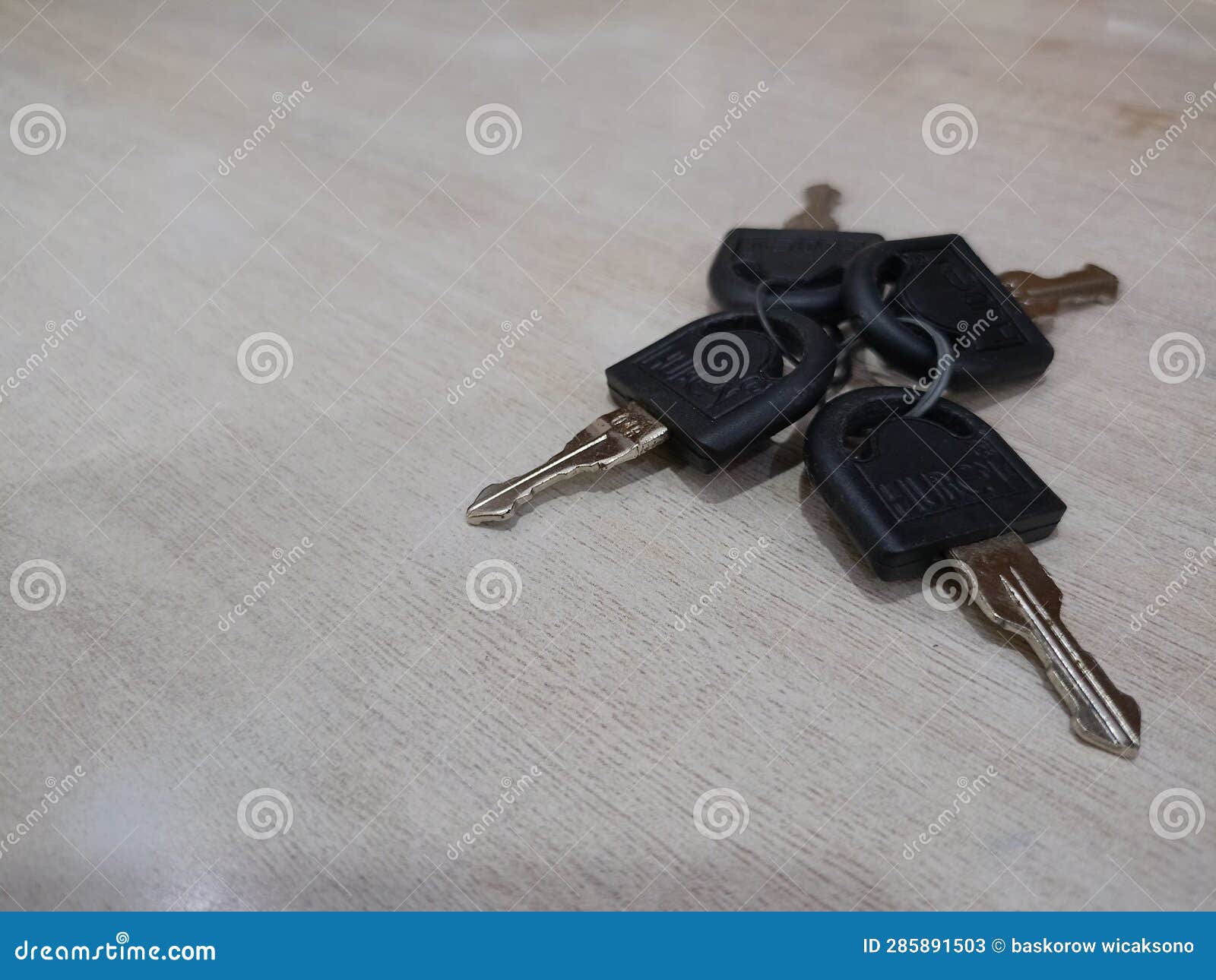 A Pile of Keys Lying on a Wooden Table Stock Image - Image of keys ...