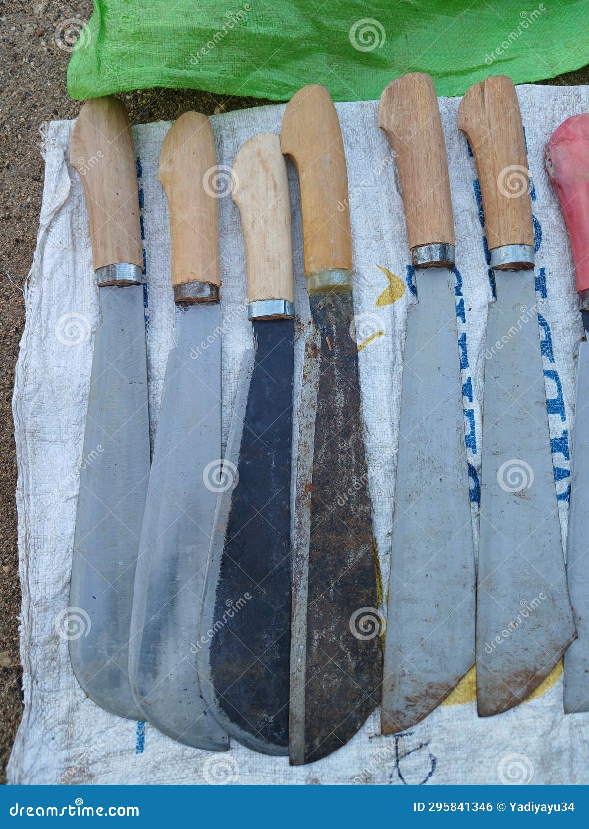 A Pile of Machetes Which Function As a Tool for Splitting or Cutting ...