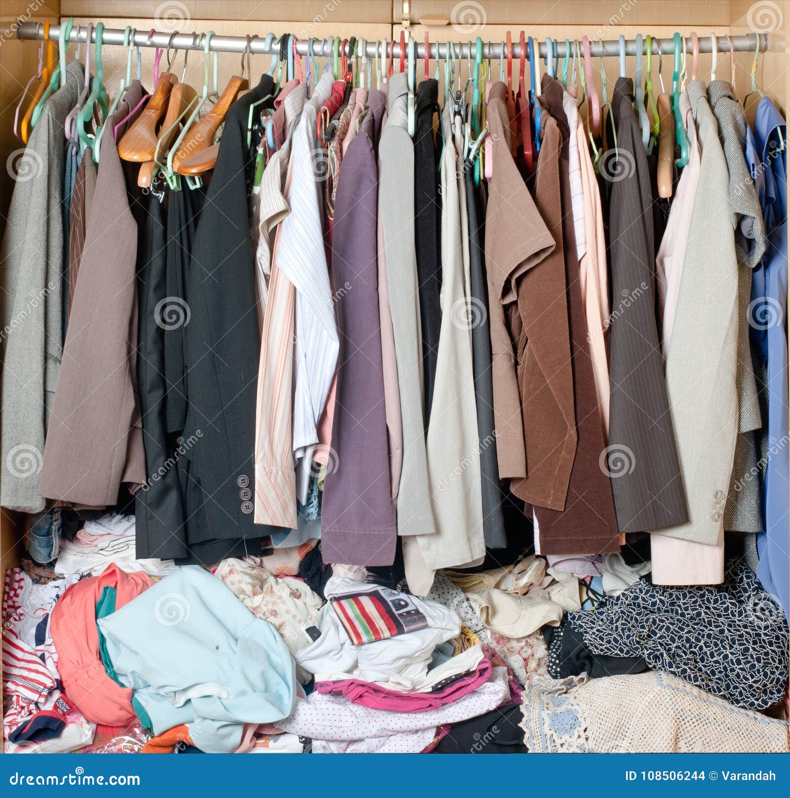 Pile Of Messy Clothes In Closet. Untidy Cluttered Woman Wardrobe ... Pile Of Messy Clothes In Closet. Untidy Cluttered Woman Wardrobe ...