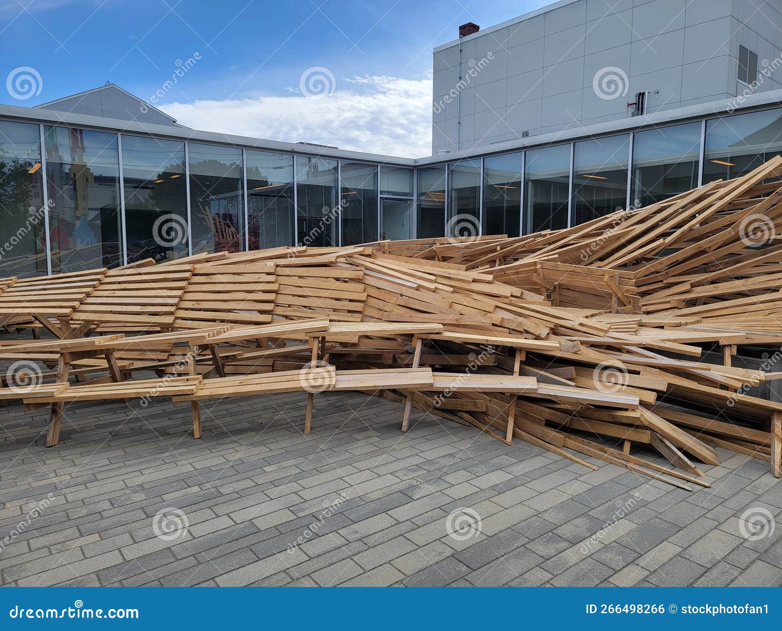 Pile or Mound of Wood Tables Outside Building with Windows Stock Photo ...