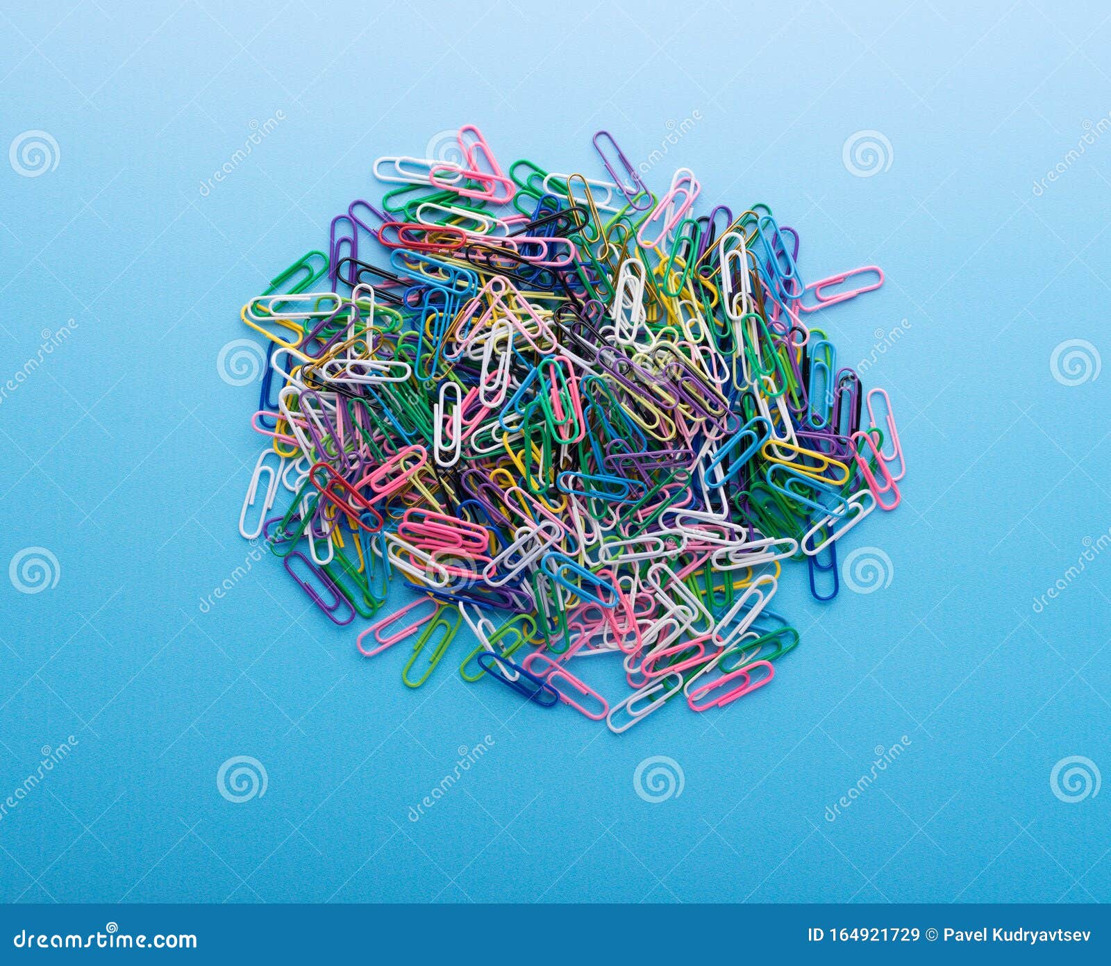 Pile of Multi Coloured Paperclips on Blue Background Stock Image ...