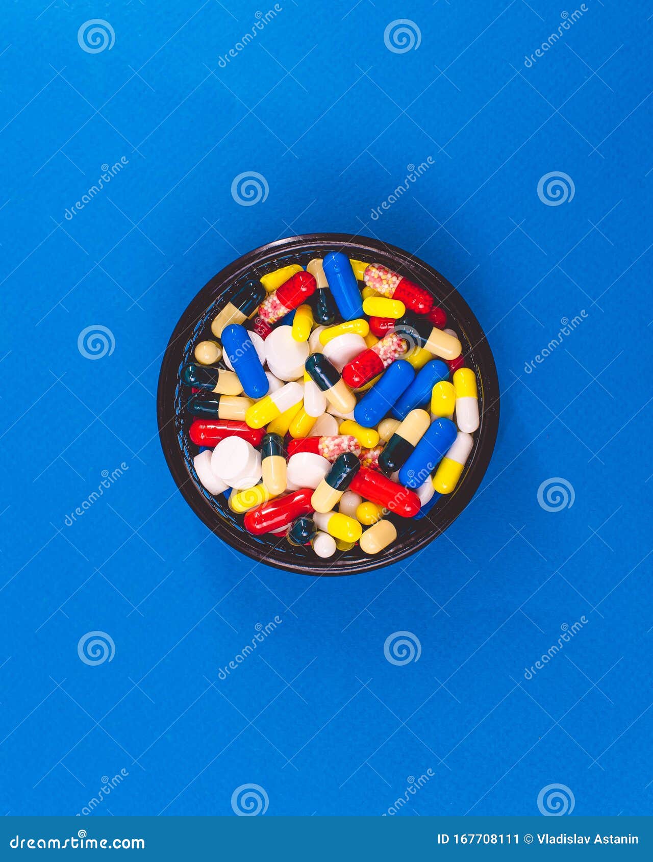 Pile of Multicolored Tablets on a Blue Background Stock Image - Image ...
