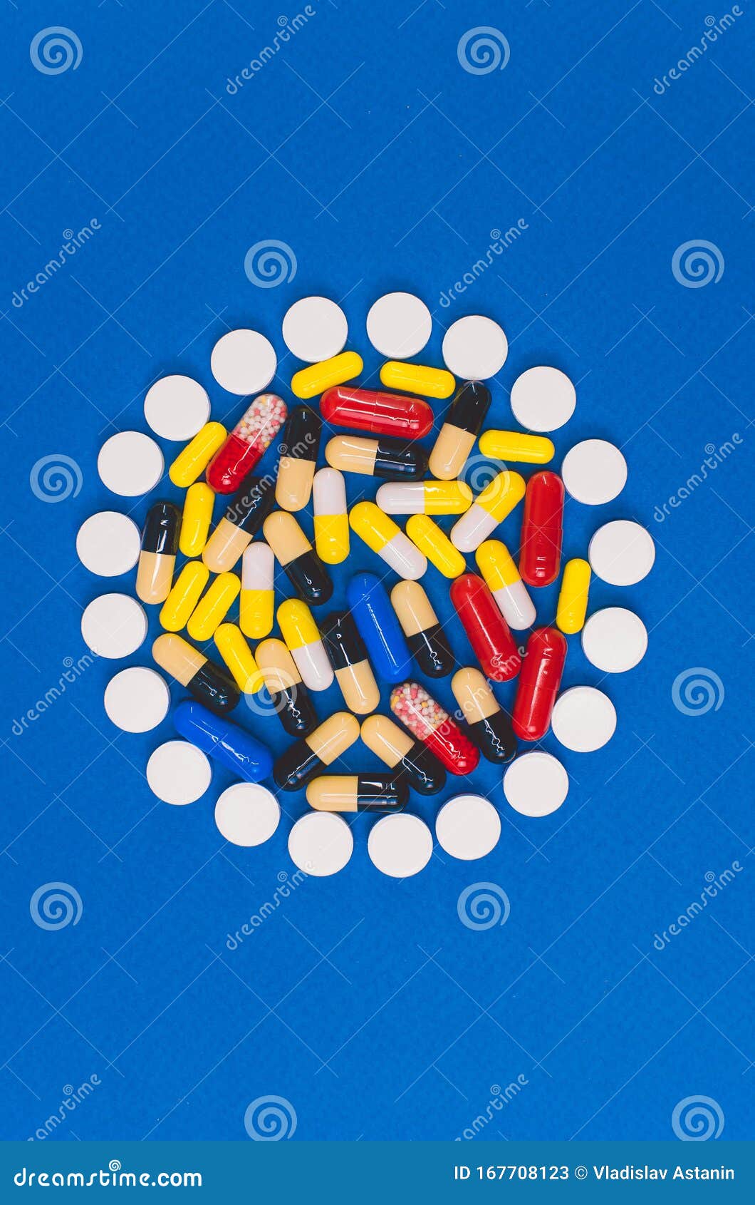 Pile of Multicolored Tablets in a White Circle and Pills on a Blue ...