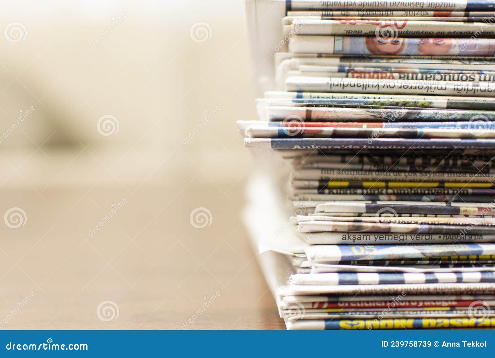Pile of Newspapers Lying on the Wooden Table with Blurred Background ...