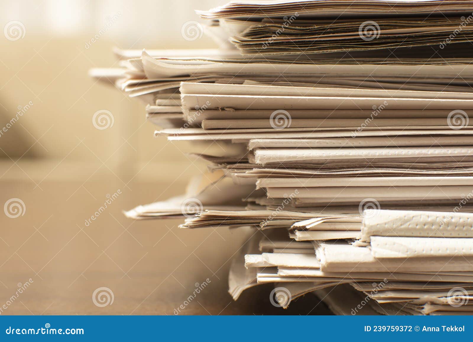 Pile of Newspapers Lying on the Wooden Table with Blurred Background ...