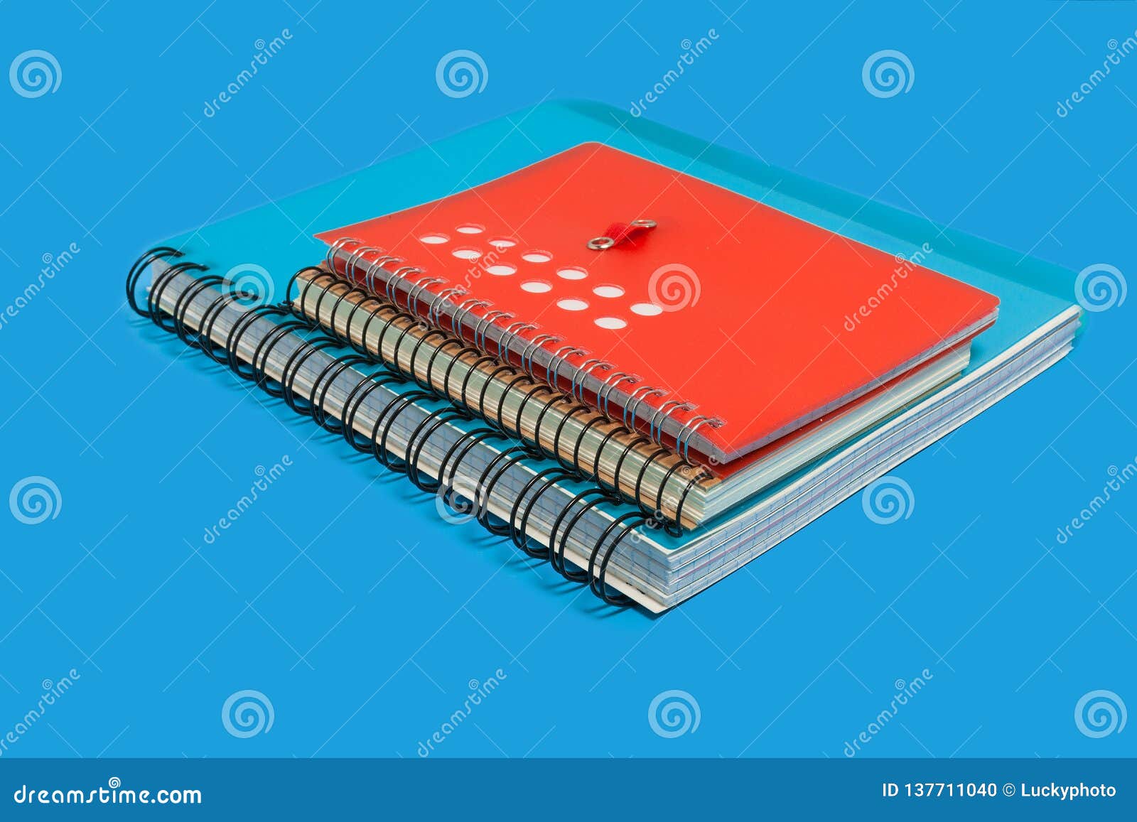 Pile of Notebooks on a Blue Background Stock Photo - Image of light ...