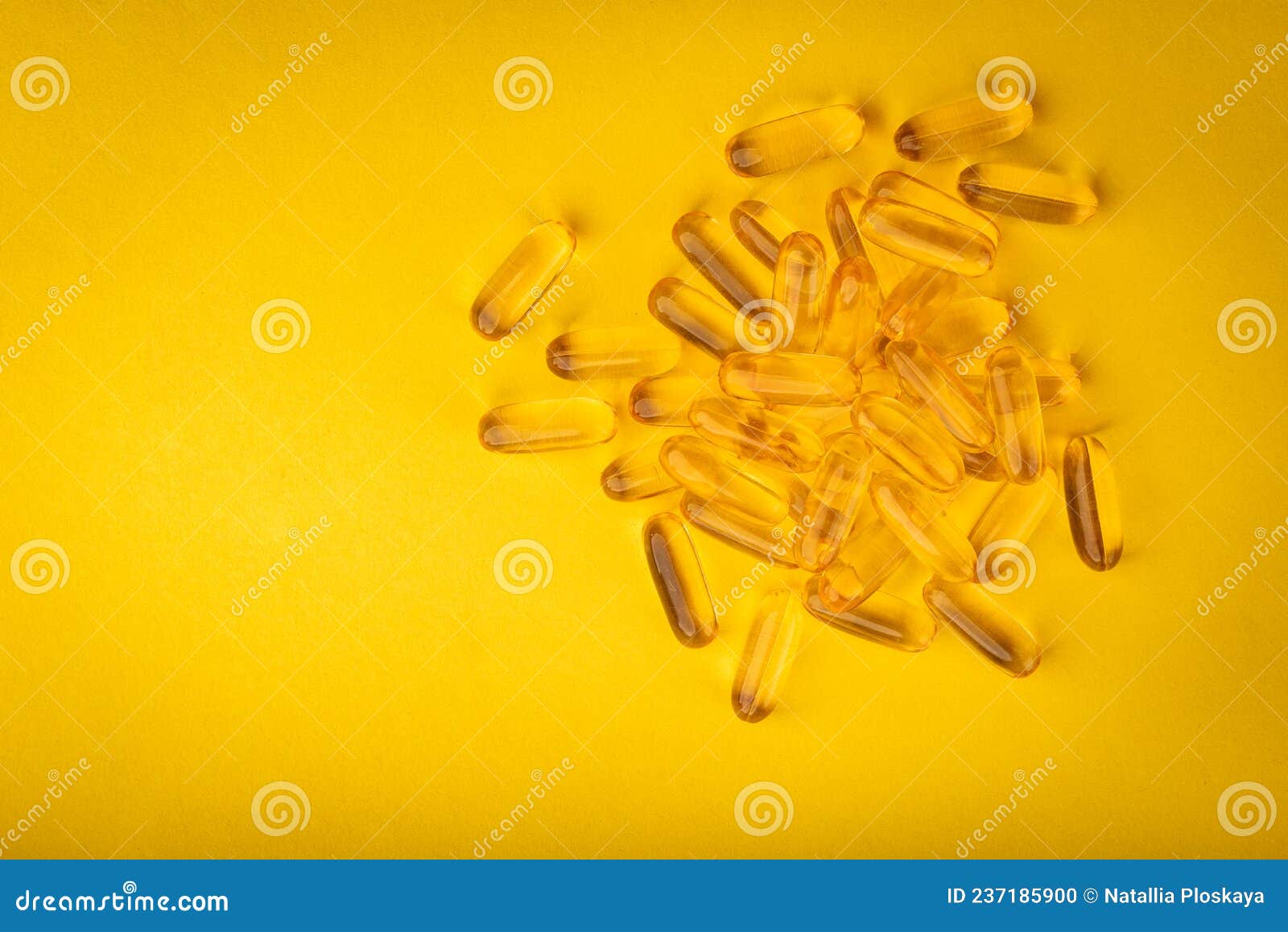 Pile of Omega-3 Capsules on Yellow Background. Stock Photo - Image of ...