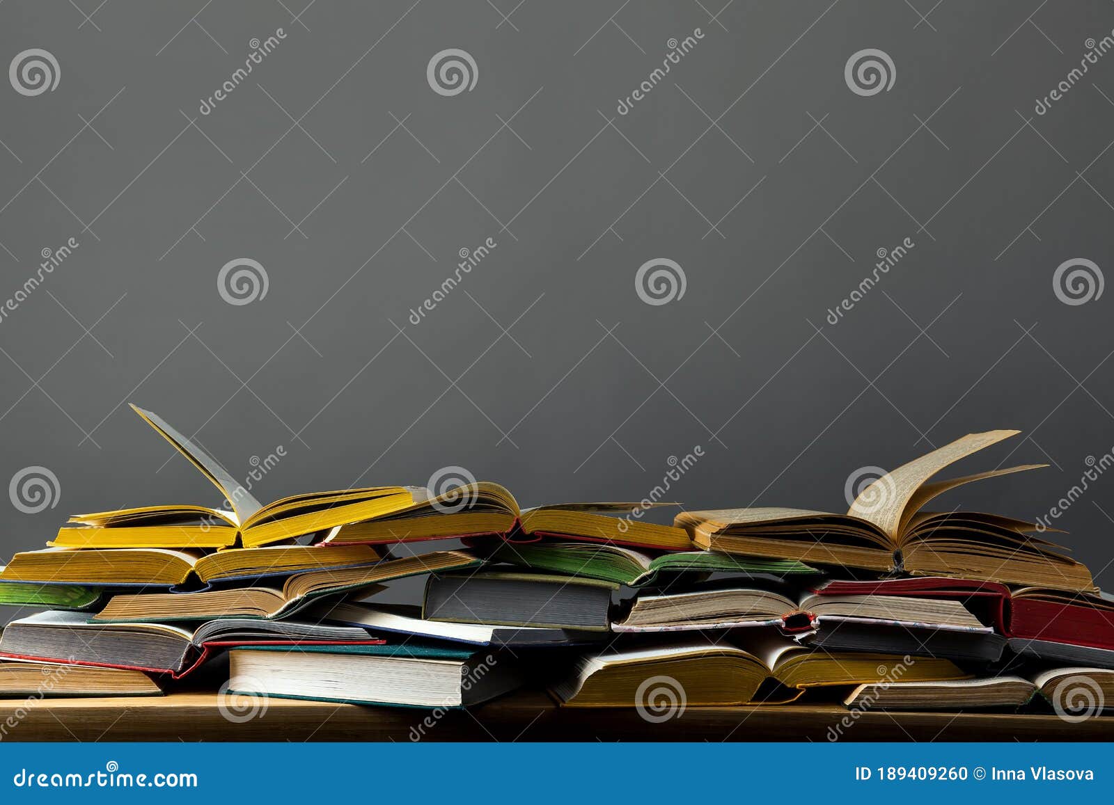 Pile of Open Books on the Table Stock Photo - Image of opened ...