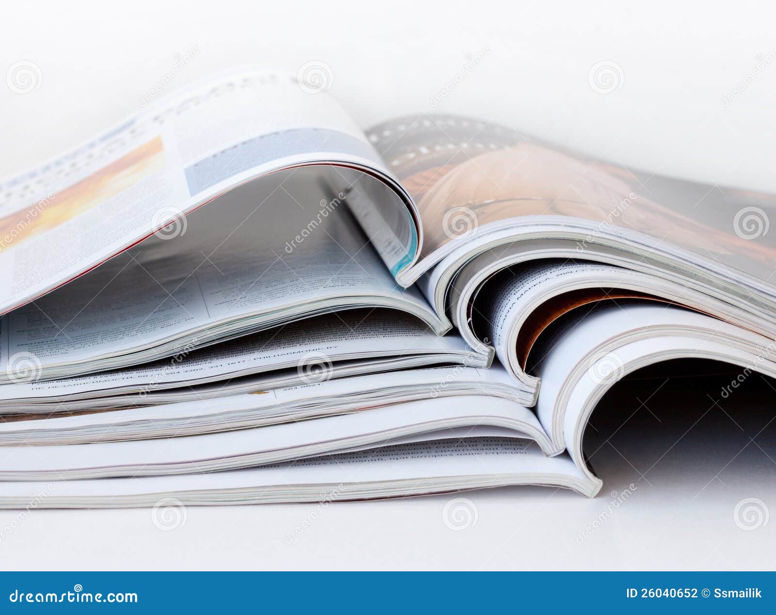 Pile of open magazines stock photo. Image of business - 26040652