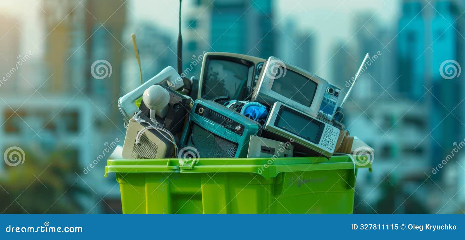A Pile of Outdated Electronic Devices in a Green Bin Against a ...