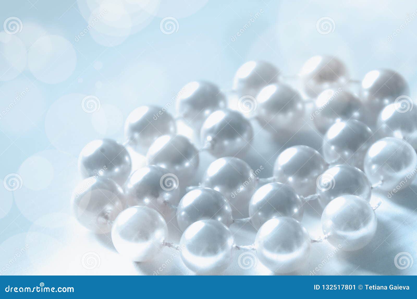 A Pile of Pearls on a Blue and White Background Stock Image - Image of ...