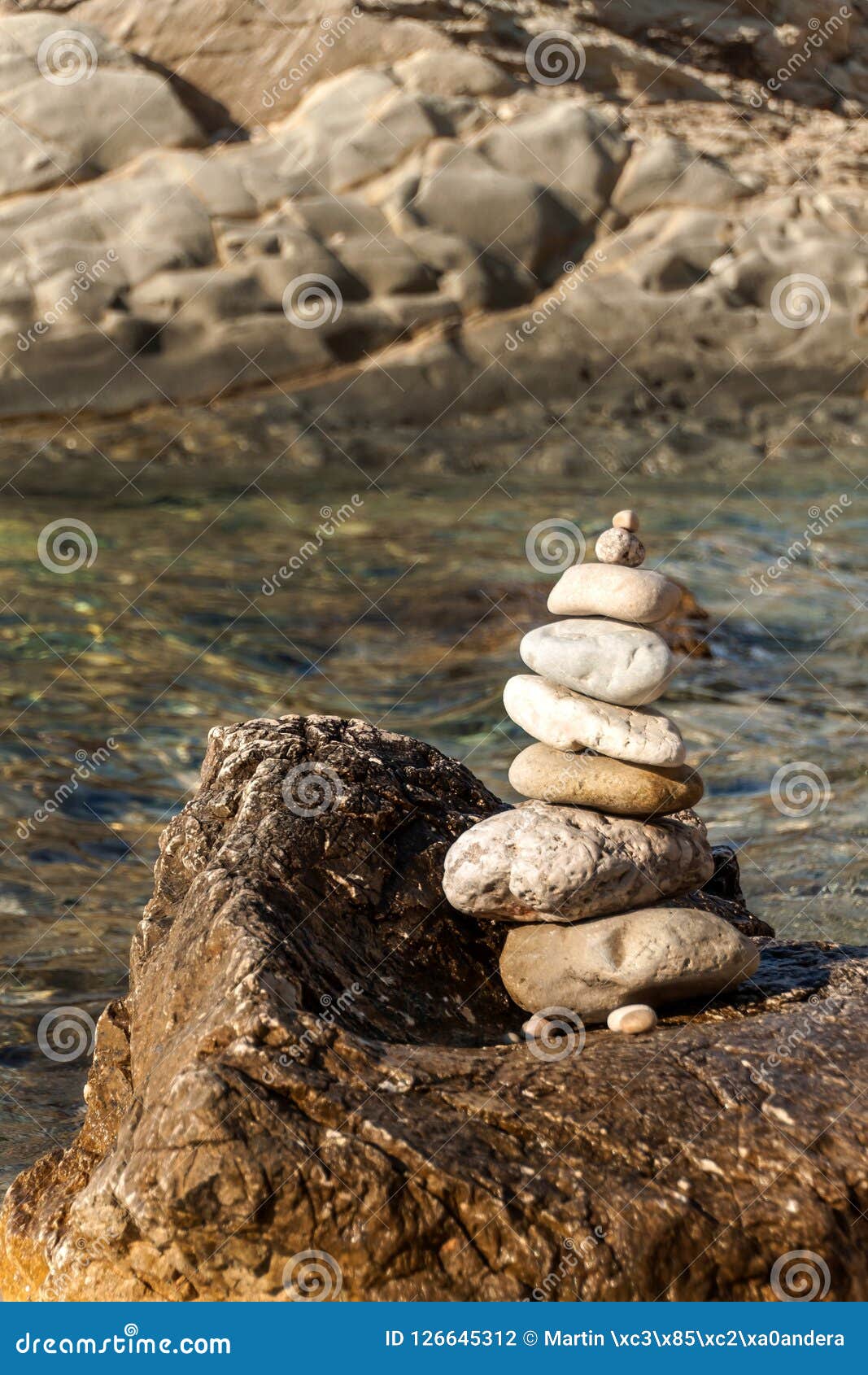 Pile of Pebbles on the Sea Front on a Beautiful Day. Pebble Stack on ...