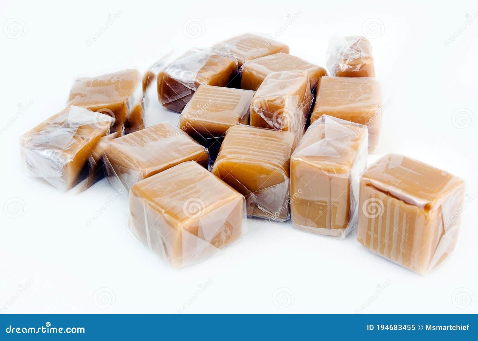 Plastic wrapped caramels stock image. Image of gold - 194683455