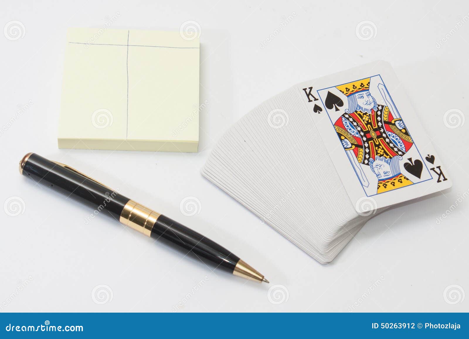 Pile of Playing Cards and Black Pencil with Notebook Stock Photo ...