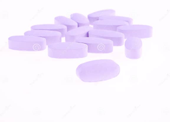 Pile of purple tablets stock image. Image of shapes, medicine - 13444917