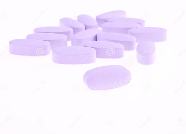 Pile of purple tablets stock image. Image of shapes, medicine - 13444917