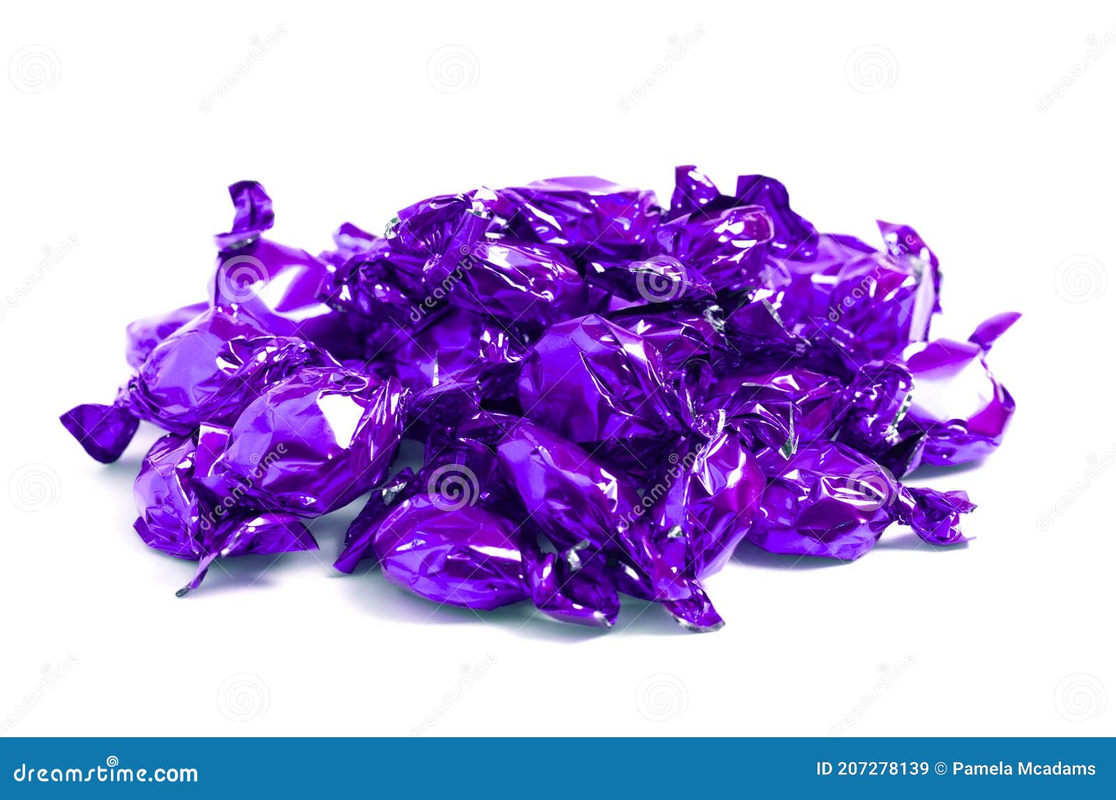 A Pile of Purple Wrapped Candy on a White Background Stock Image ...