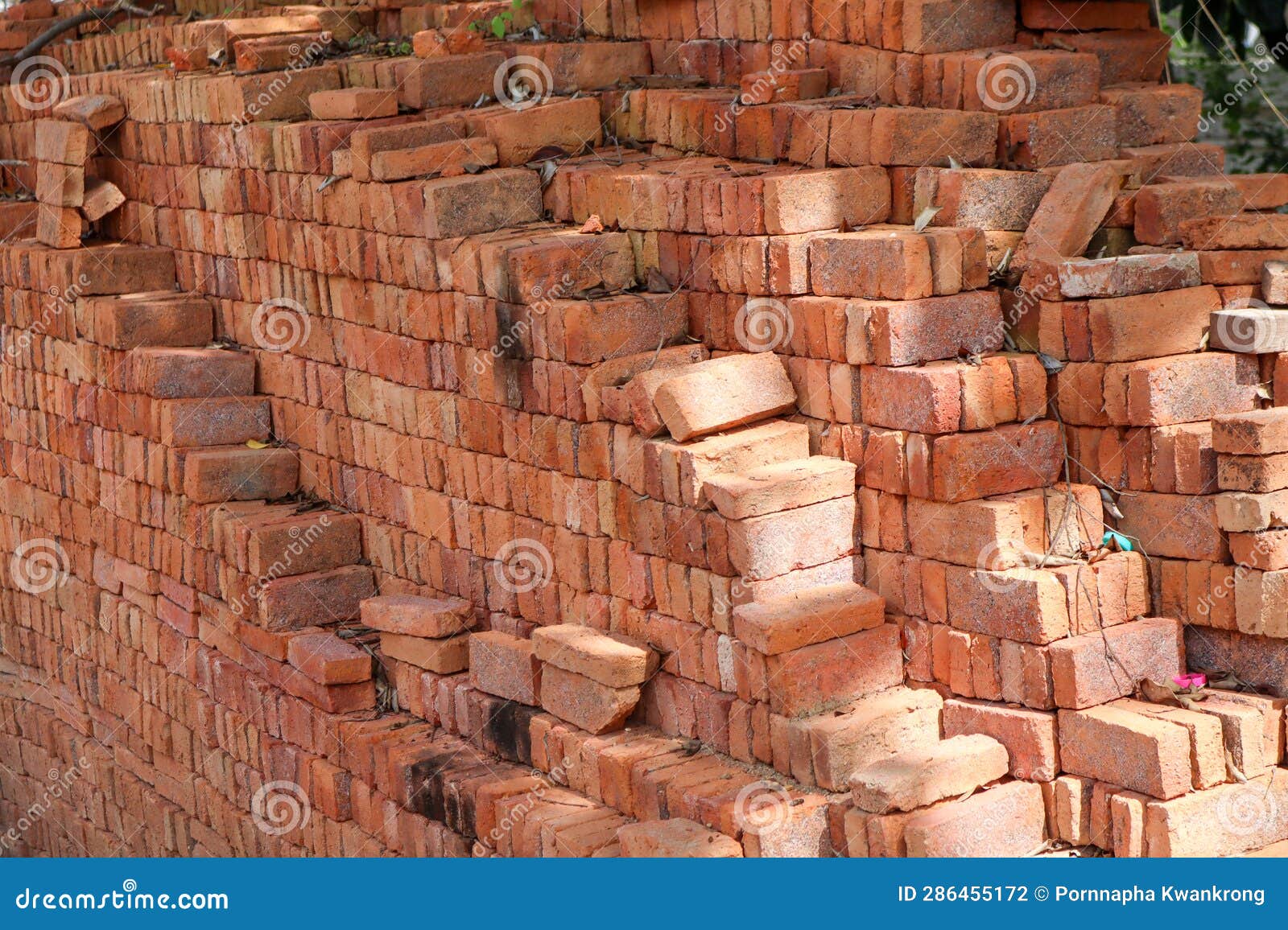 Pile of Red Bricks at Construction Site. Brick Background Stock Photo ...