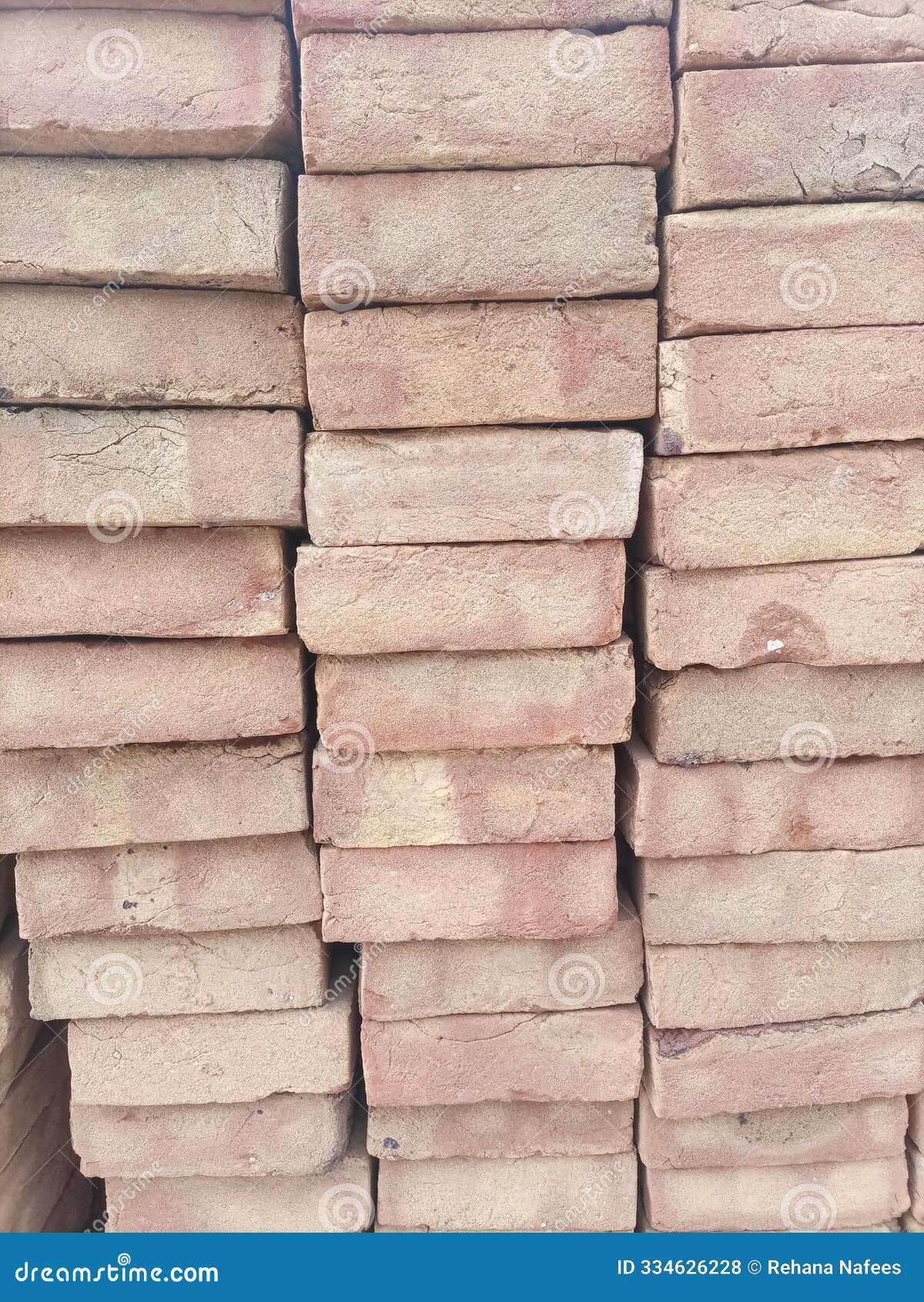 Pile of red clay bricks stock photo. Image of focus - 334626228